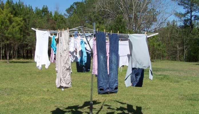 Why does sunlight fade our clothes and what colors fade the most?